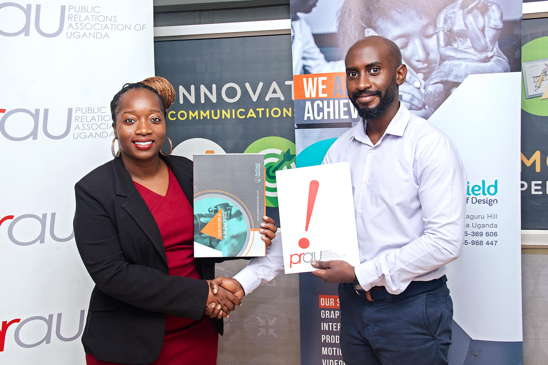 Tina Wamala, President PRAU shake hands with Rwemereza Abaasa, Artfield ...